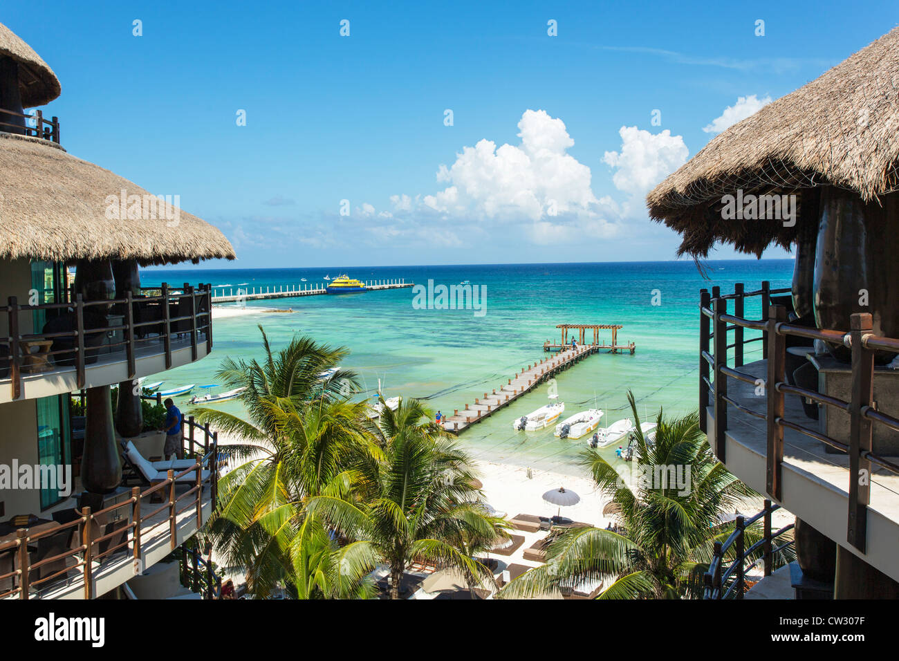 Mexico,Quintana Roo, Playa del Carmen, pier at beach jutting out to the ...