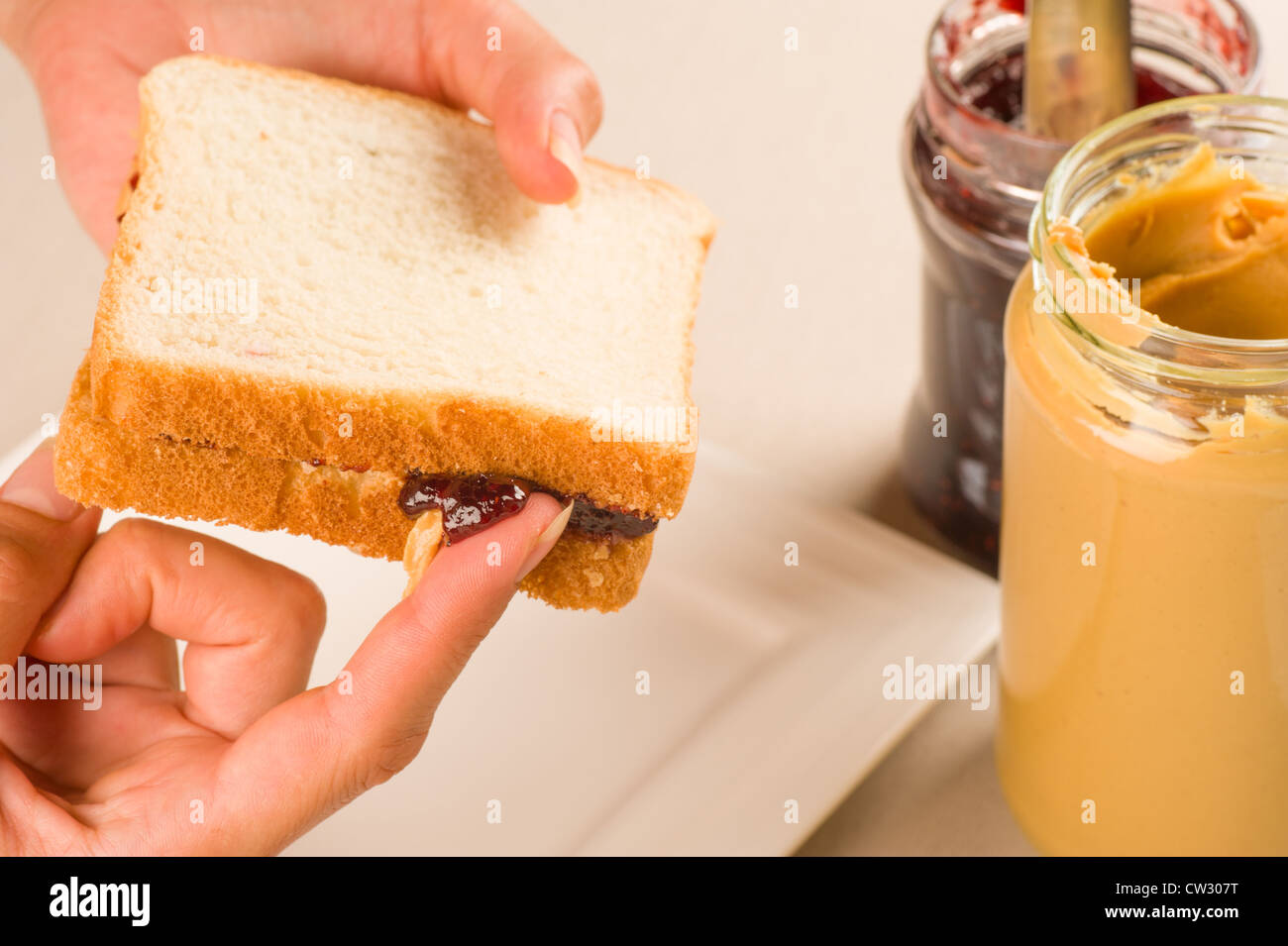 Dripping raspberry jam and peanut butter sandwich Stock Photo - Alamy