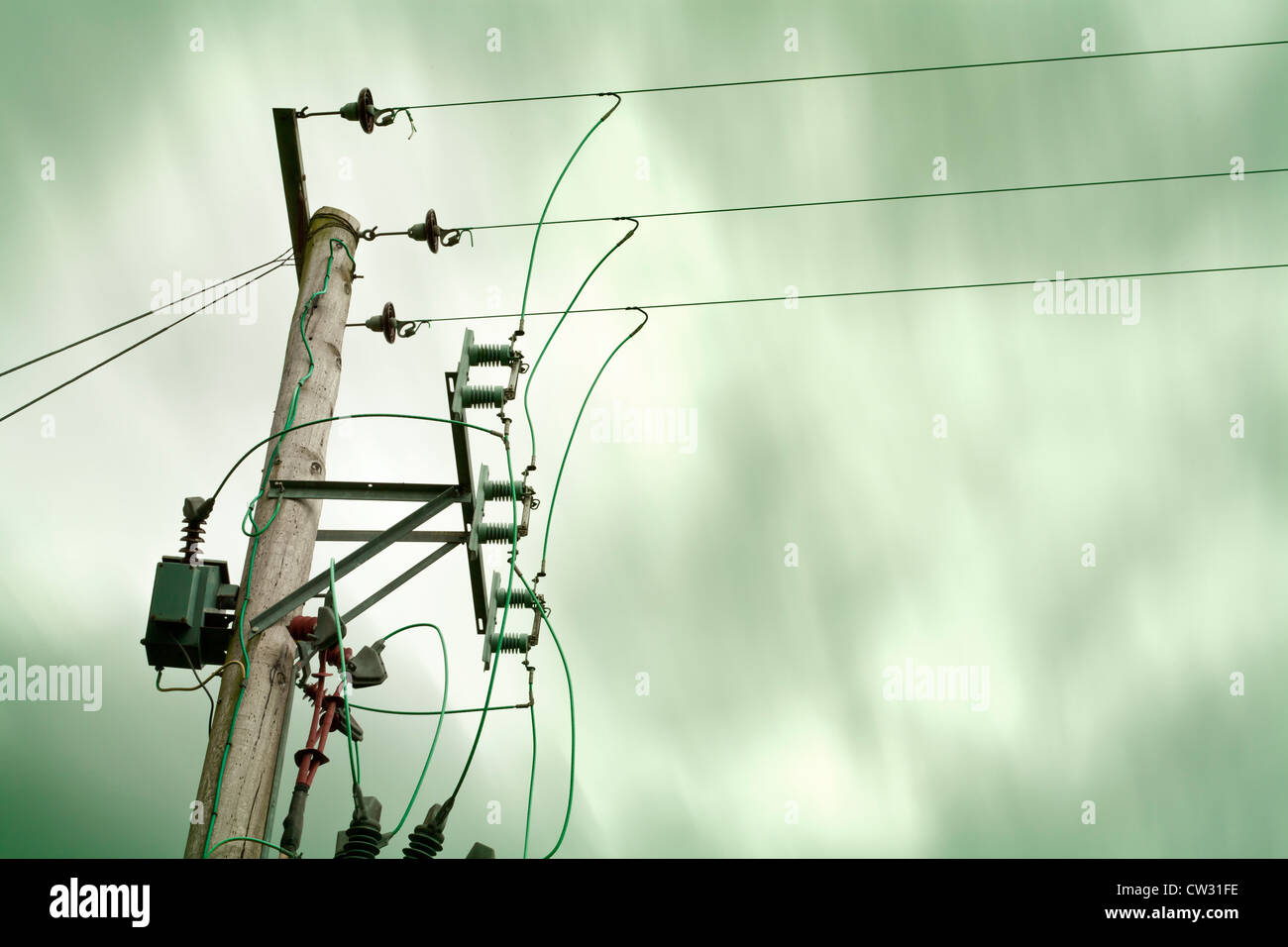 Pylon with clouds rushing past it Stock Photo - Alamy
