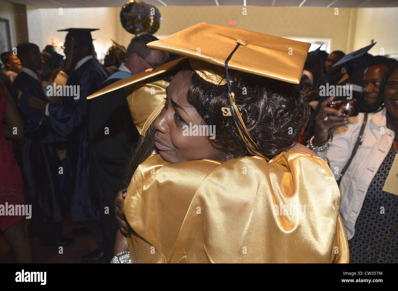 Two graduating high school friends hug each other Stock Photo - Alamy