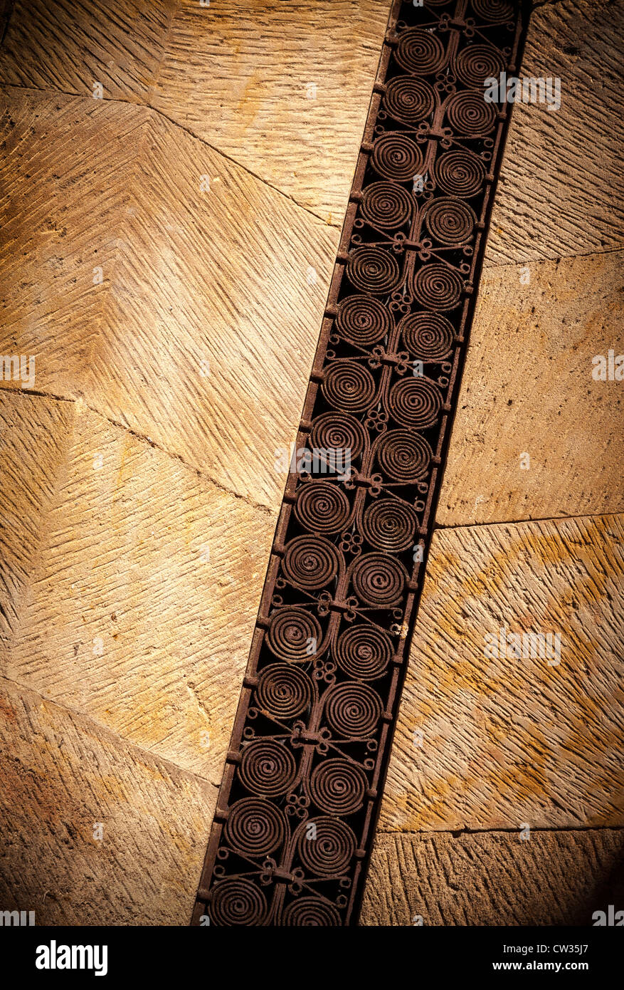Sectional view of a patterned grate over a church window in the old ...