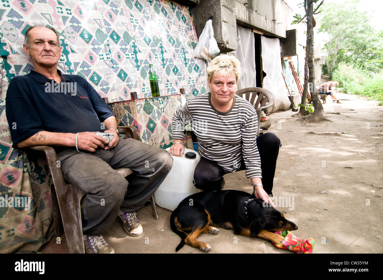 A homeless couple with their dog Stock Photo - Alamy