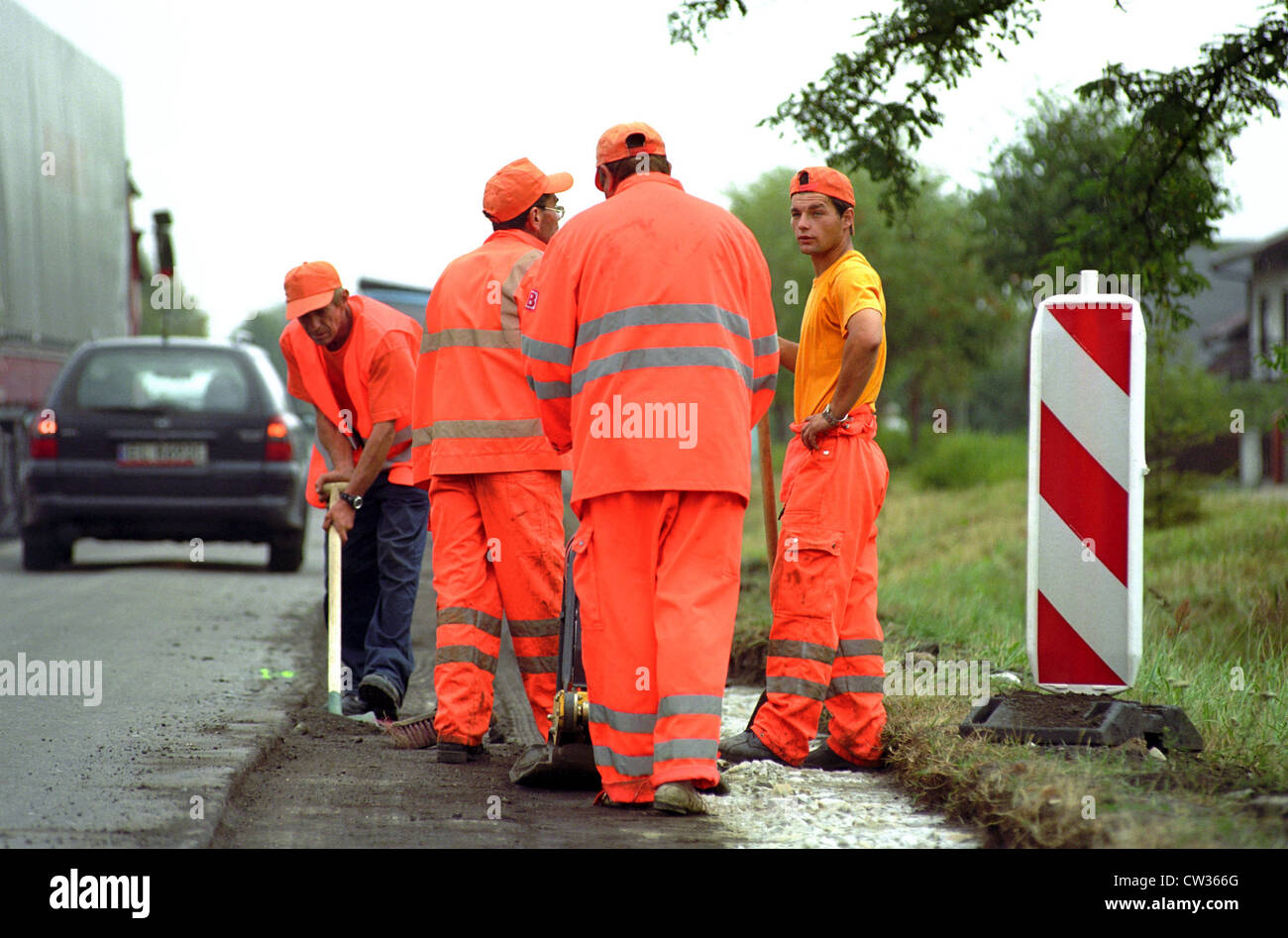 Construction workers at road works, Poland Stock Photo - Alamy