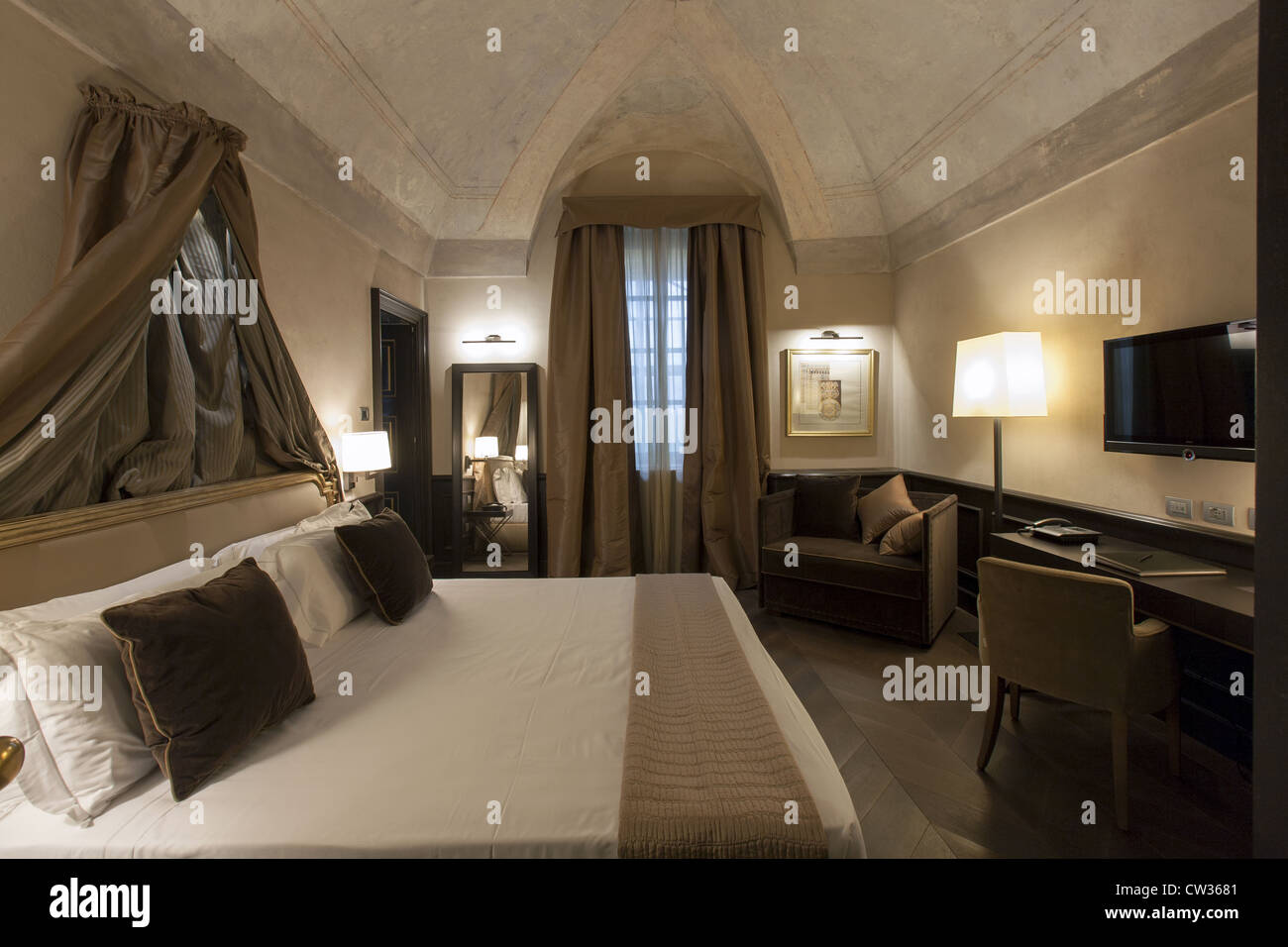 Bed room in a classic italian elegant hotel Stock Photo - Alamy