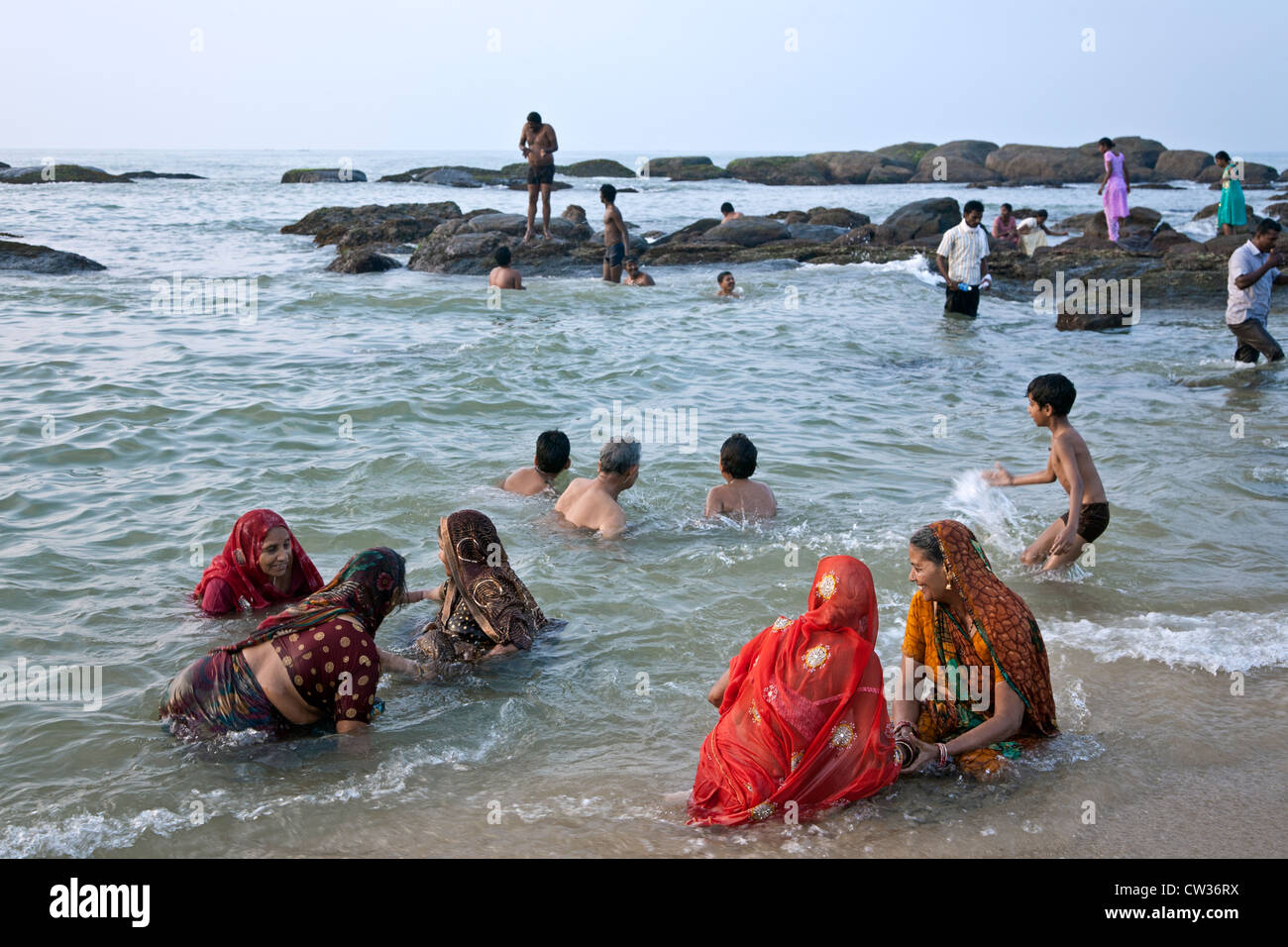 Hindu pilgrims bathing in the sea. Kanyakumari. Cape Comorin. India ...