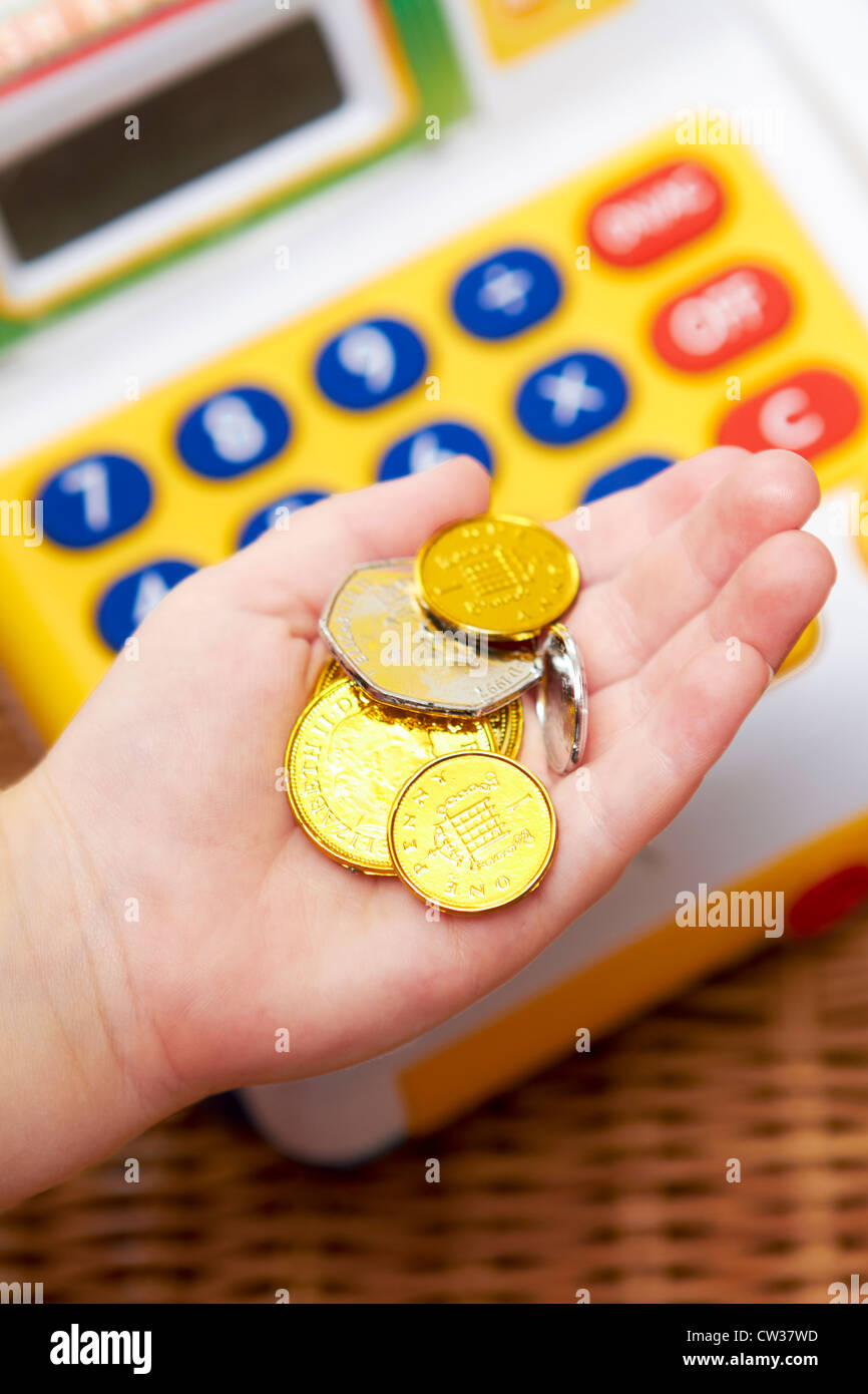 Young Girl Playing Shops With Toy Cash Register Stock Photo - Alamy