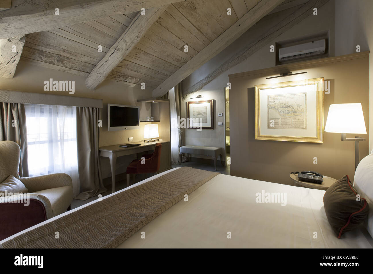 Bed room in a classic italian elegant hotel Stock Photo - Alamy