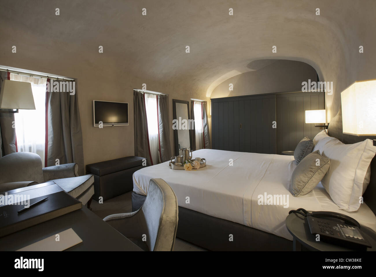 Bedroom in a classic traditional hotel in Italy Stock Photo - Alamy