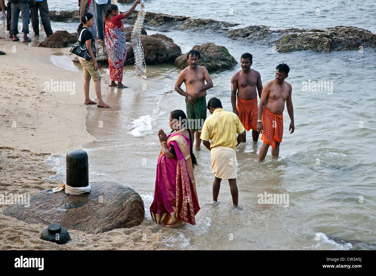 Hindu woman worshiping a Shiva lingam. Kanyakumari. Cape Comorin. India ...