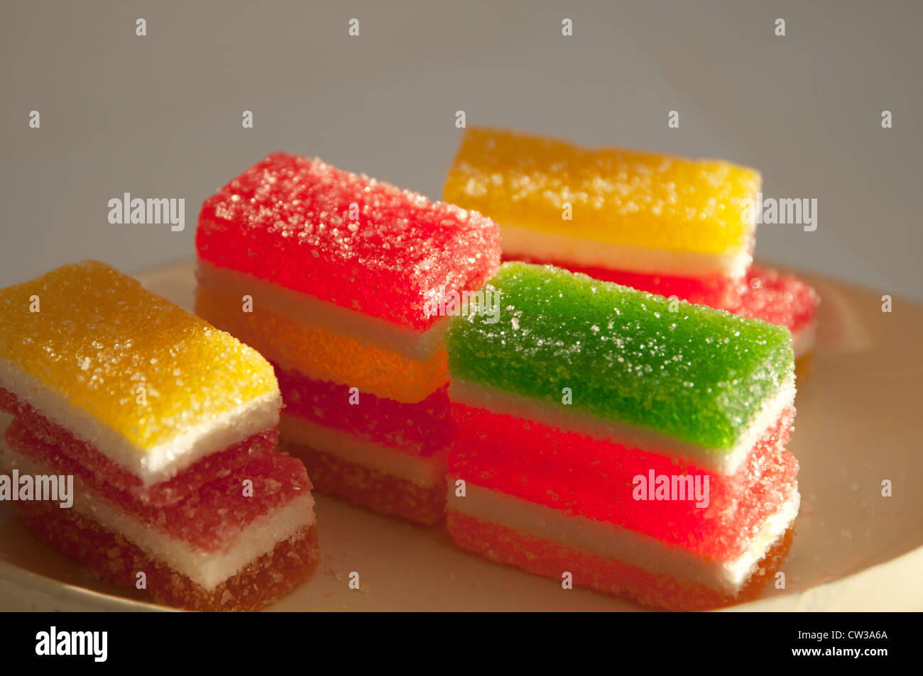 Different fruit-paste candies on a small plate in a sunlight Stock ...