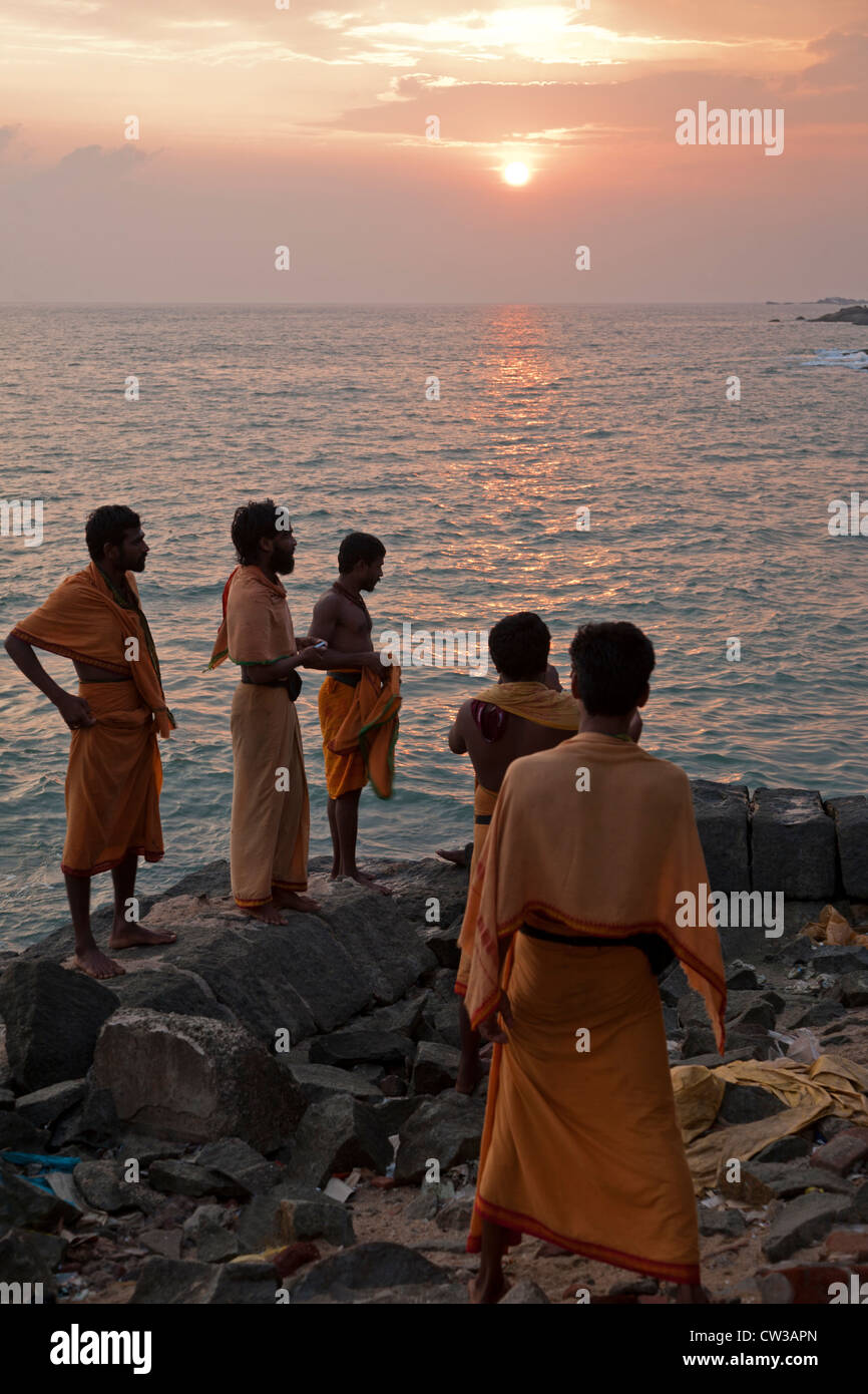 Hindu men contemplating the sunset. Kanyakumari. Cape Comorin. India ...