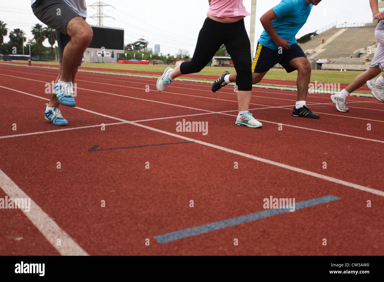 lower half of runners on a race track Stock Photo - Alamy