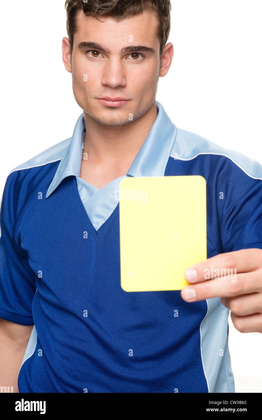 Young referee with yellow card in front of white background Stock Photo ...