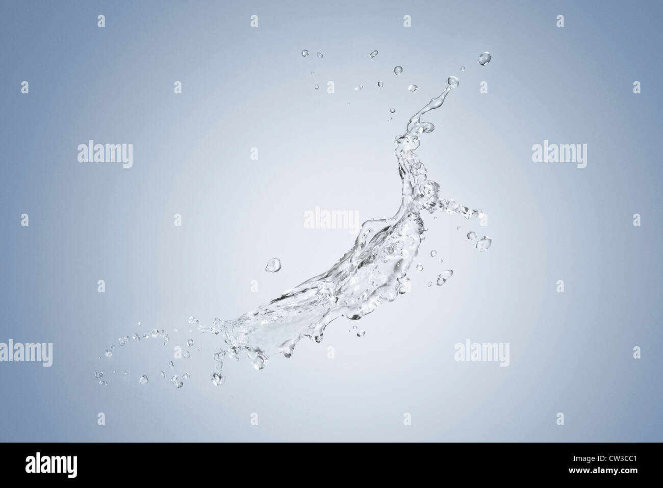 Pure water in front of blue background Stock Photo - Alamy