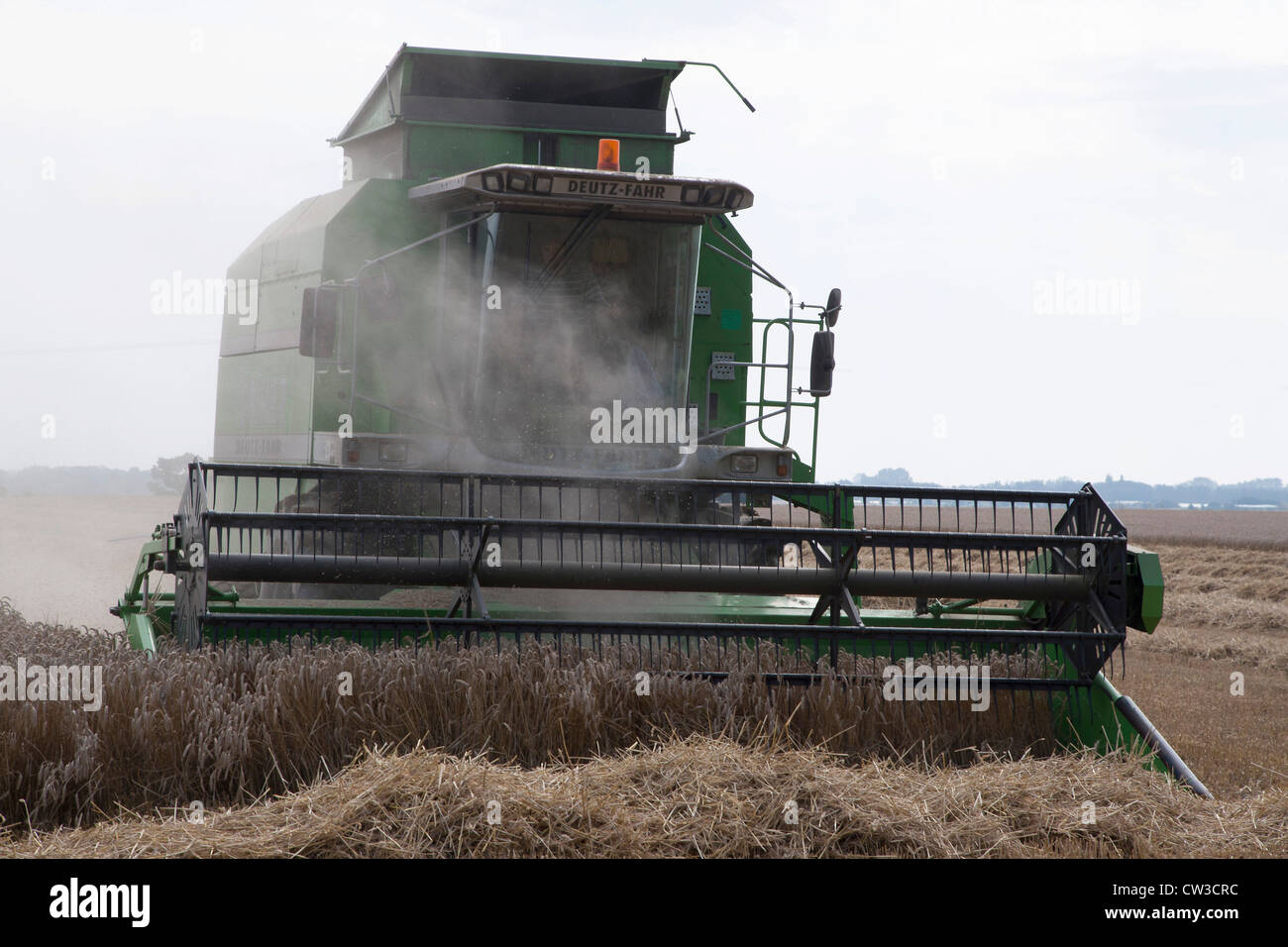 Combine Harvester working cutting crops Stock Photo - Alamy