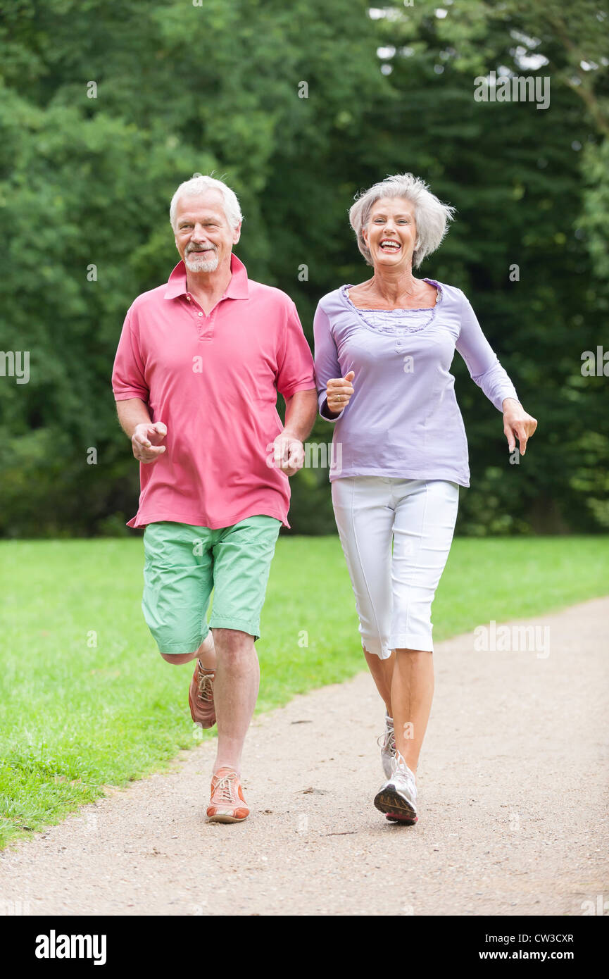 Active senior couple in the park Stock Photo - Alamy