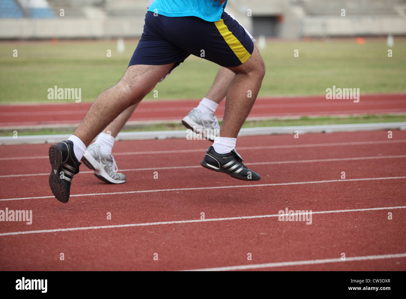 lower half of runners on a race track Stock Photo - Alamy