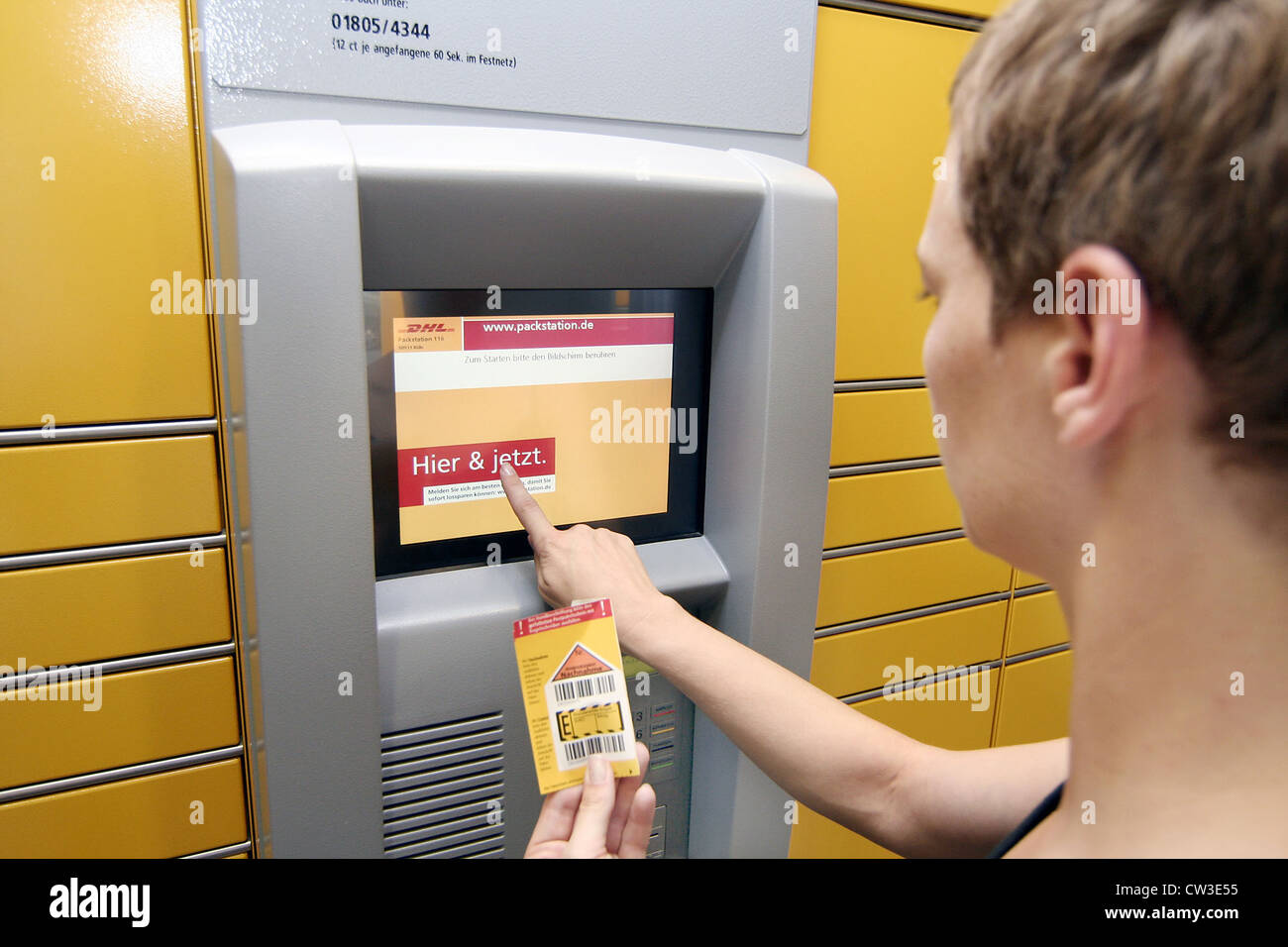 Woman in a post office at the packing station Stock Photo - Alamy