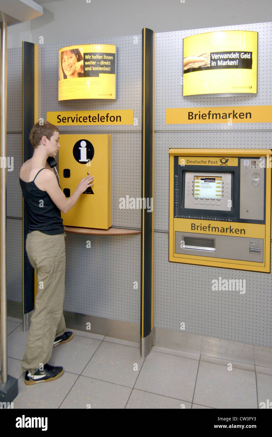 Woman in a post office on telephone service Stock Photo - Alamy