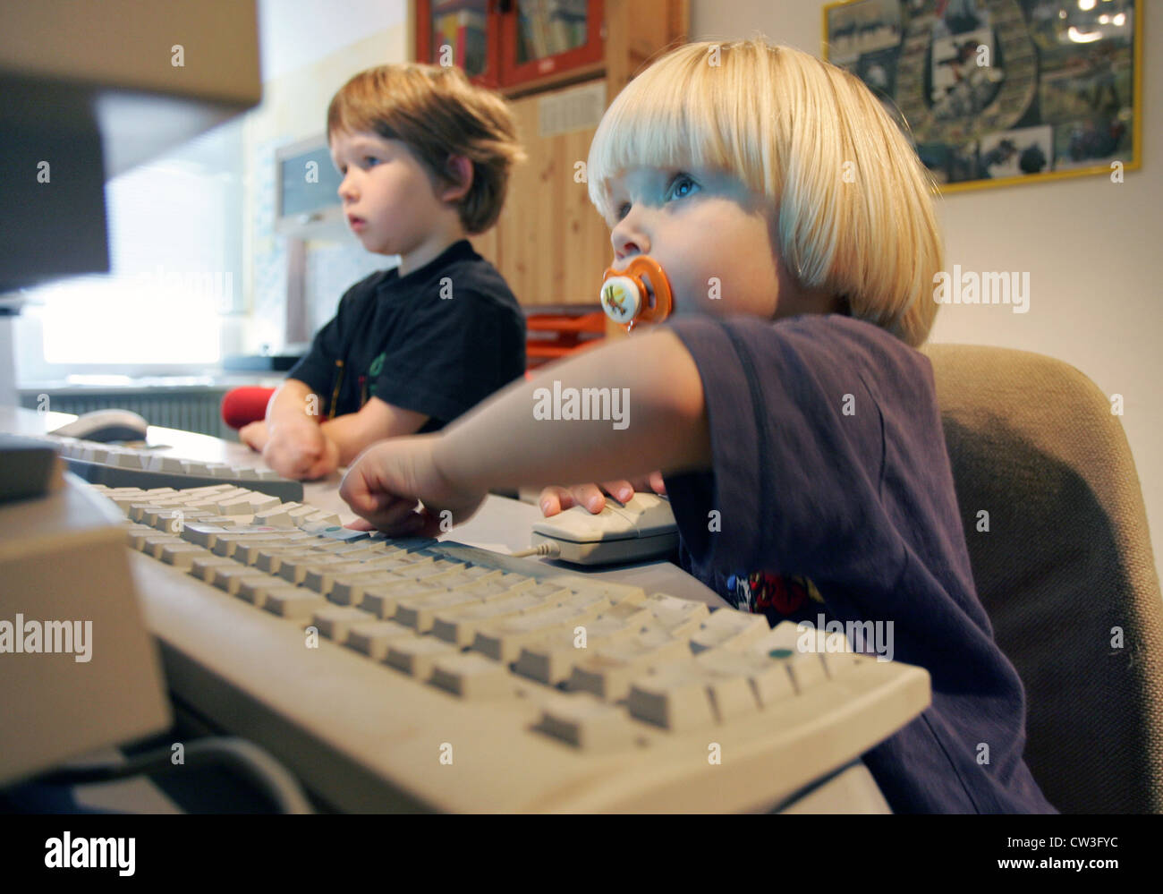 Children try hi-res stock photography and images - Alamy