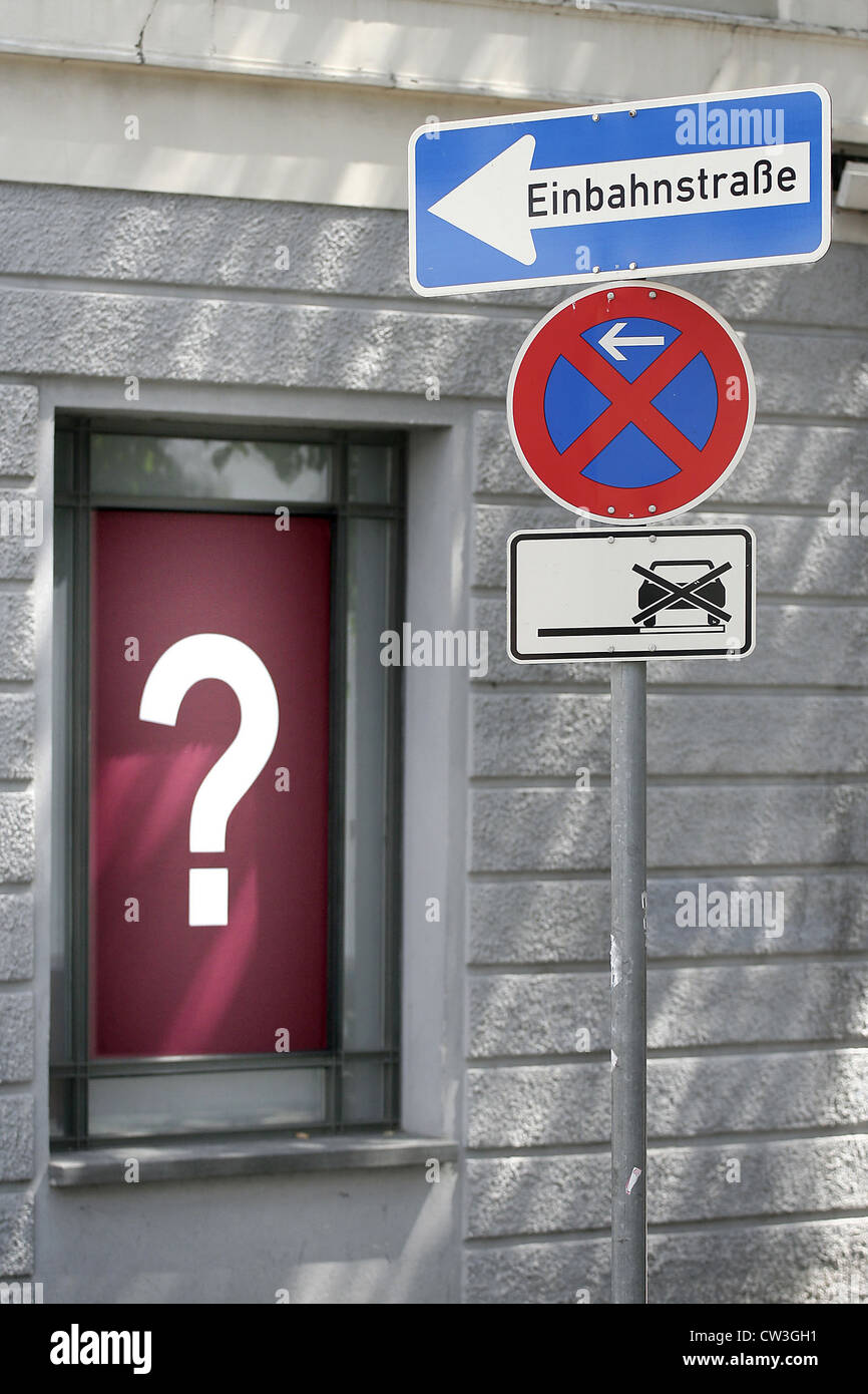 One-way street sign with a big question mark in the background Stock ...