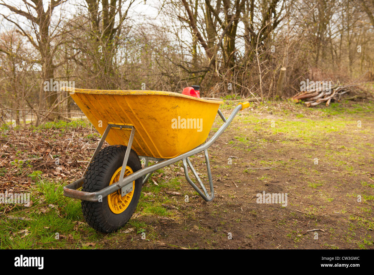 Yellow wheelbarrow from the gardener Stock Photo - Alamy