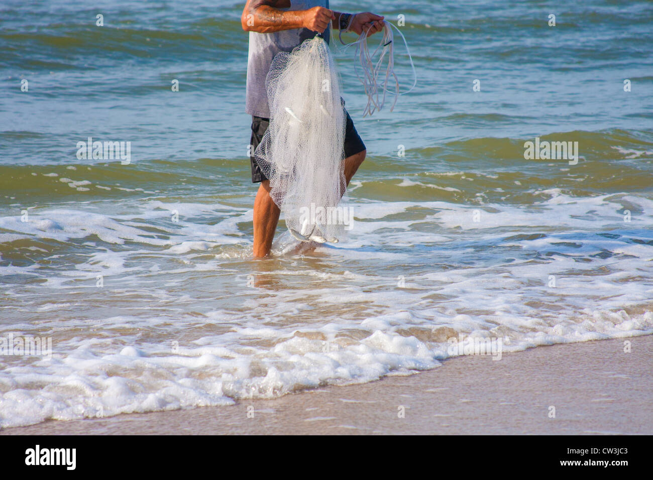 Cast Net Fishing For Bait Stock Photo - Alamy