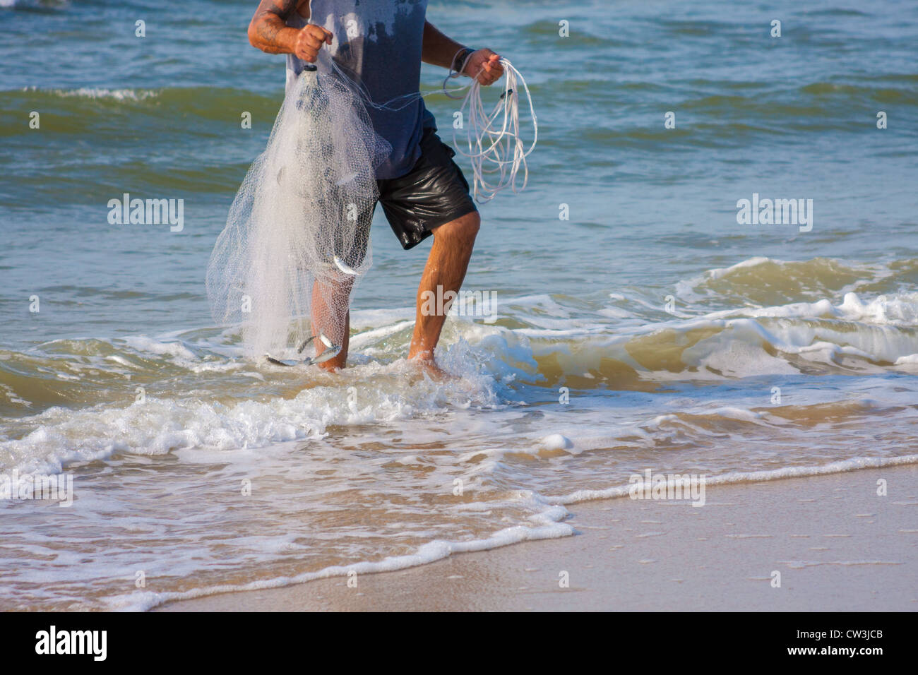 Cast Net Fishing For Bait Stock Photo - Alamy