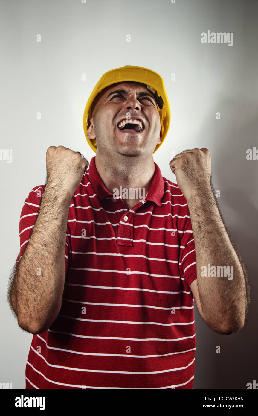 Construction worker is very happy Stock Photo - Alamy
