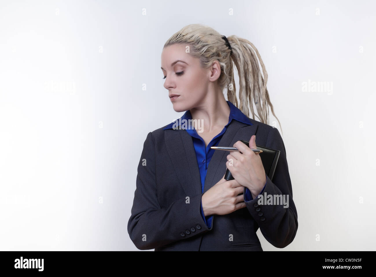 Business person with dreadlock hair standing on white background ...