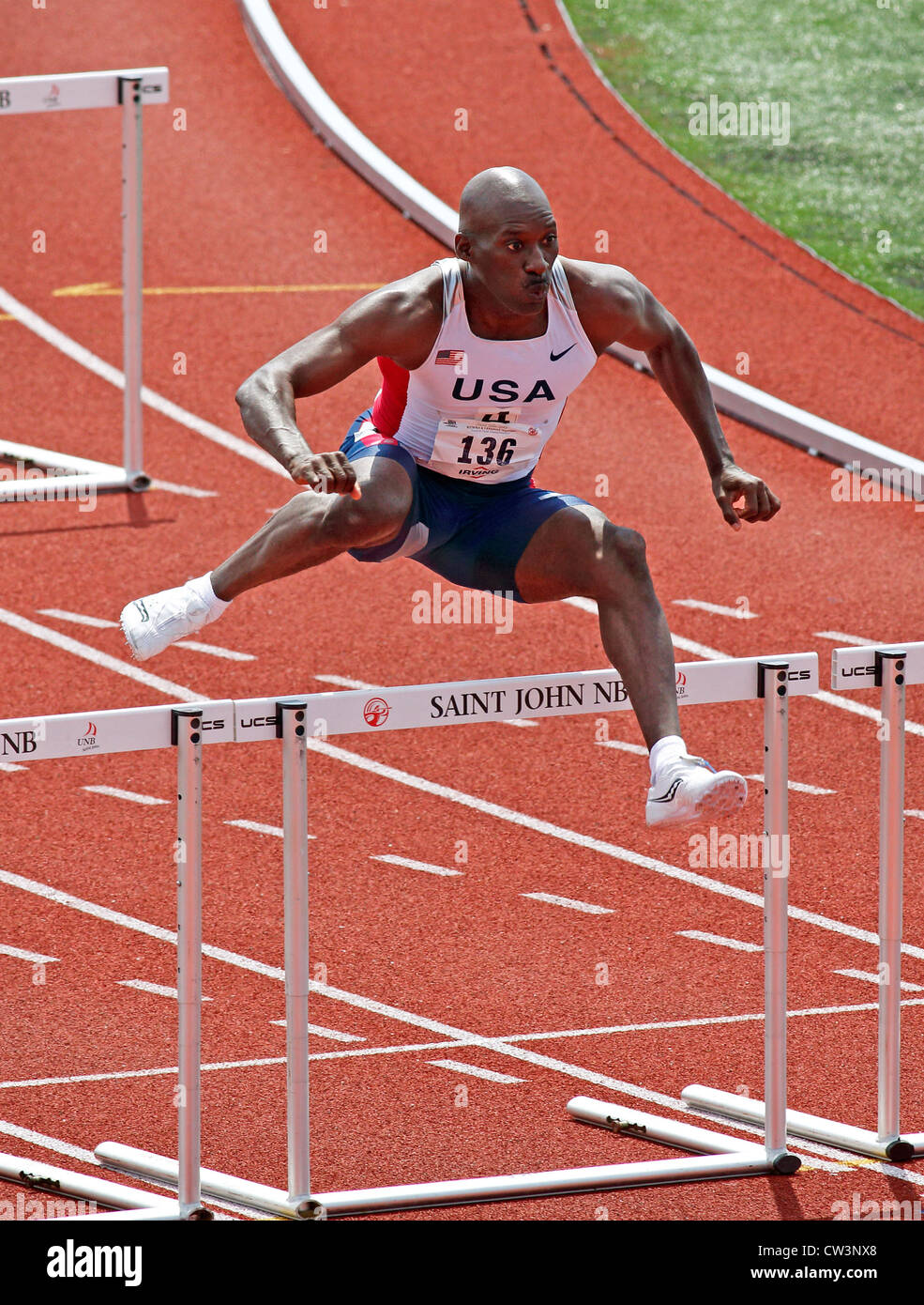 Kenneth Eaton of USA runs in the hurdles at the 2012 NCCWMA & CMA Track ...