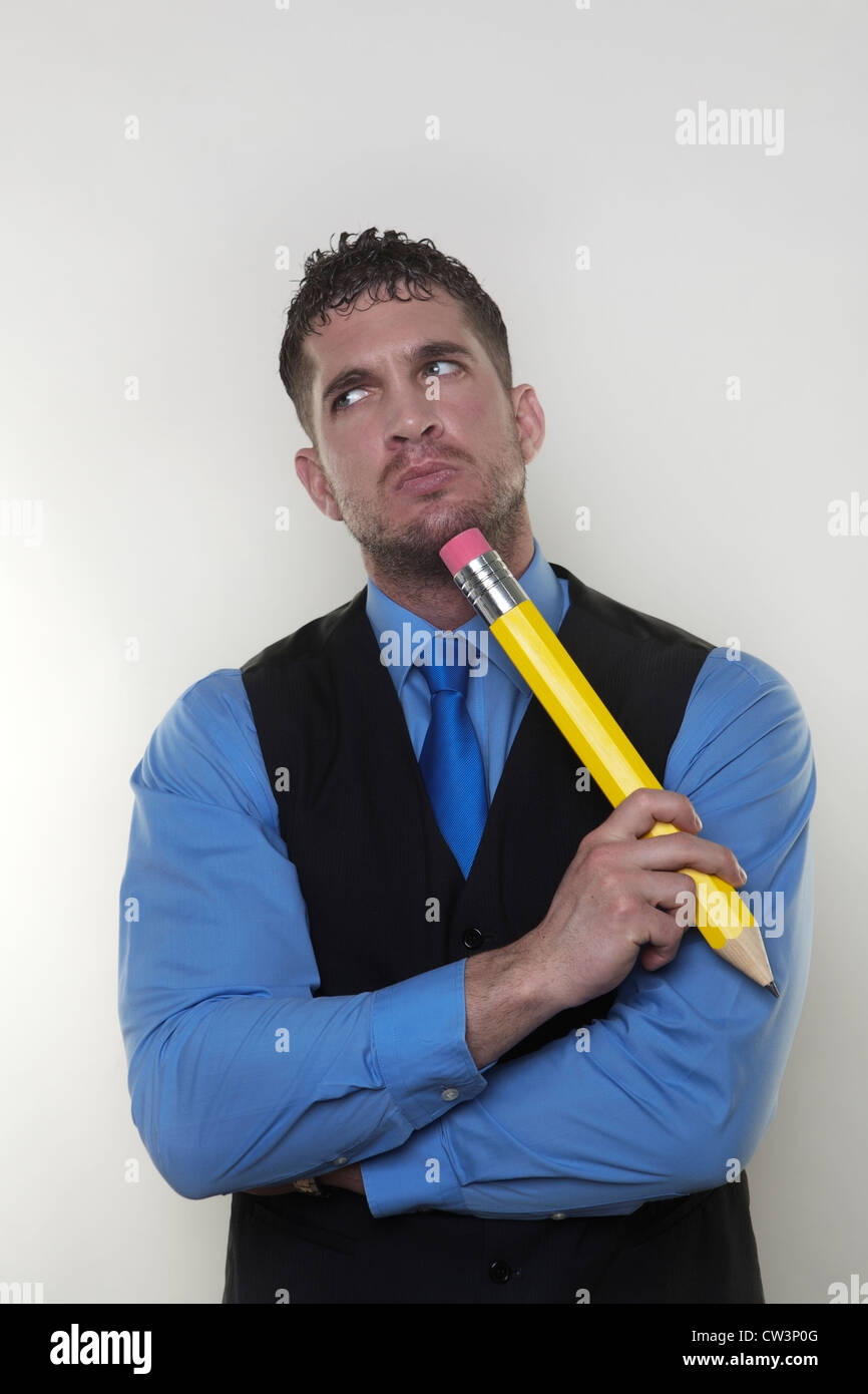 business man with a very large pencil looking a bit silly Stock Photo ...