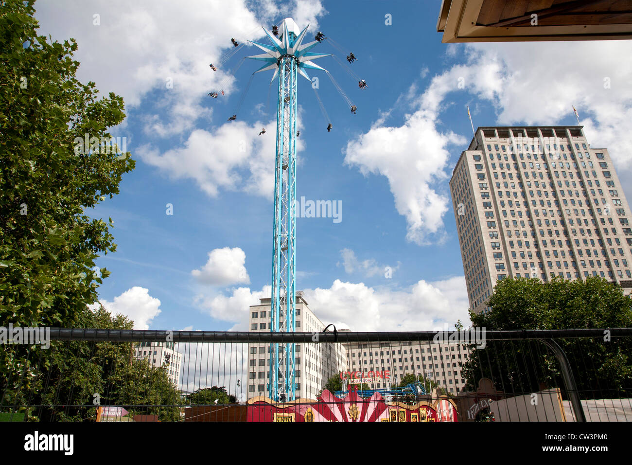 A very tall giant carousel rises from The Jubilee Gardens on the South ...