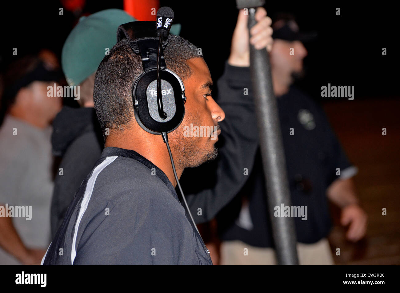 high school football coach wearing a headset for communication during a ...