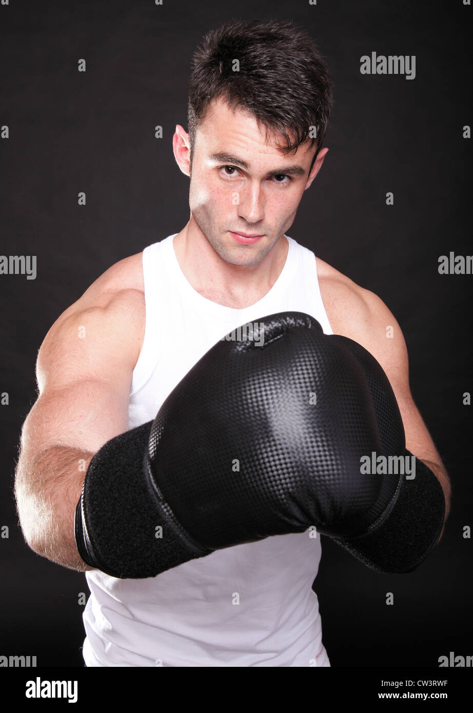 Portrait sportsman boxer in studio against dark background Stock Photo ...