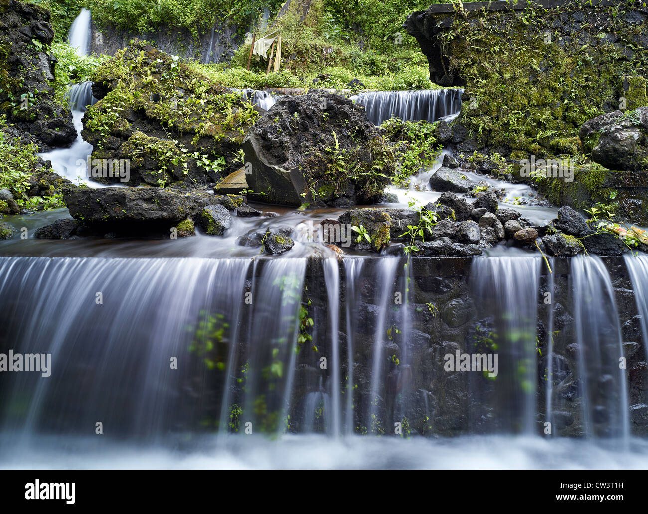 The sacred water temple of Pura Mengening. The waters here flow down ...
