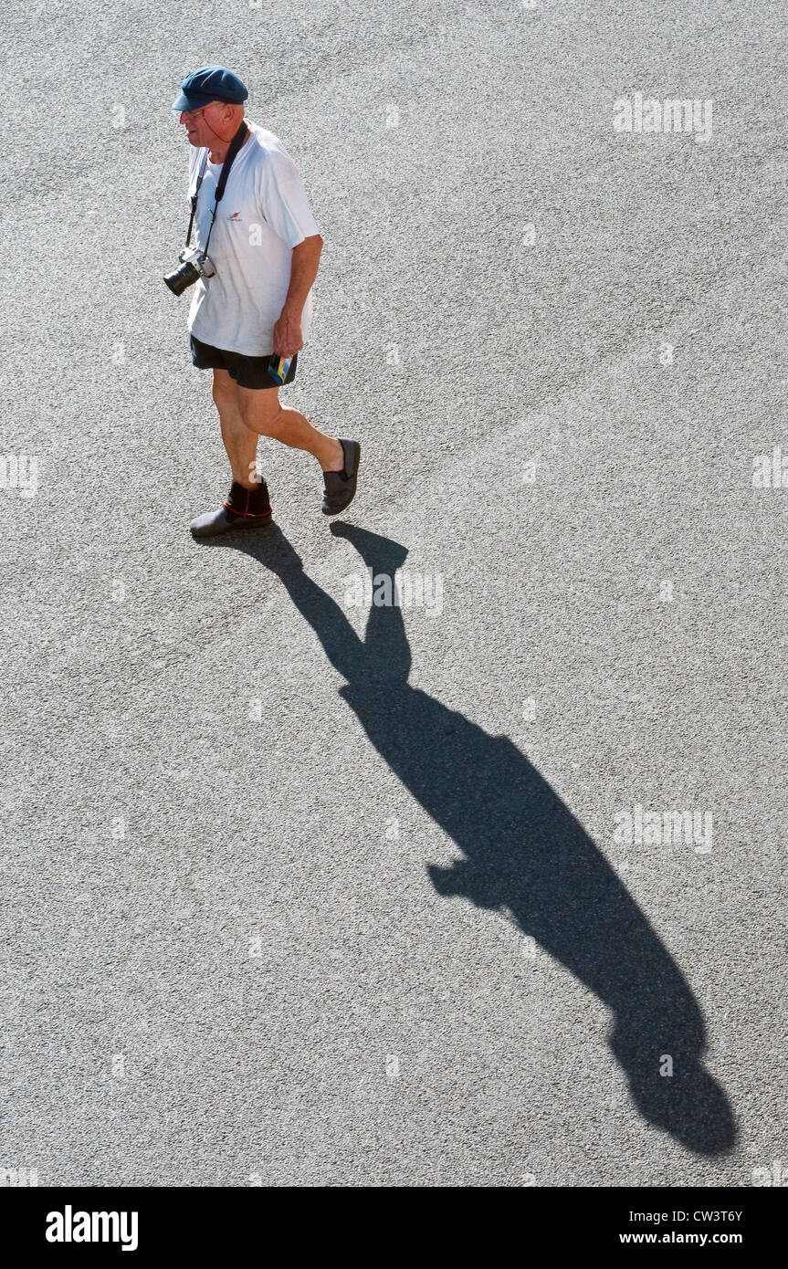 Overhead view of man with camera / and shadow - France Stock Photo - Alamy