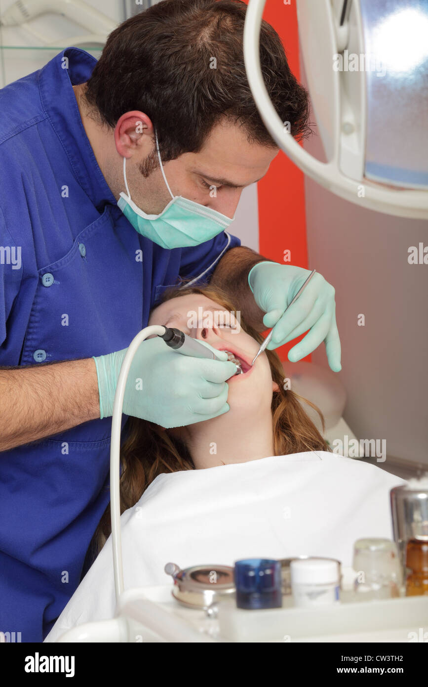 Dentist drilling tooth young patient hi-res stock photography and ...