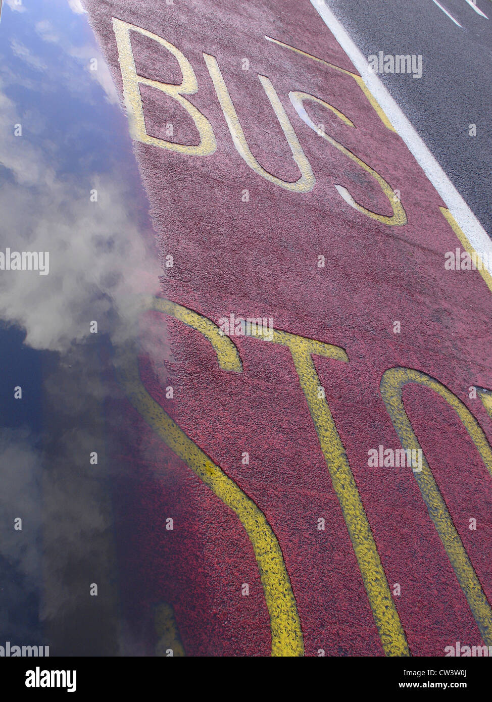 Bus stop sign marking on asphalt road, London England UK Stock Photo ...