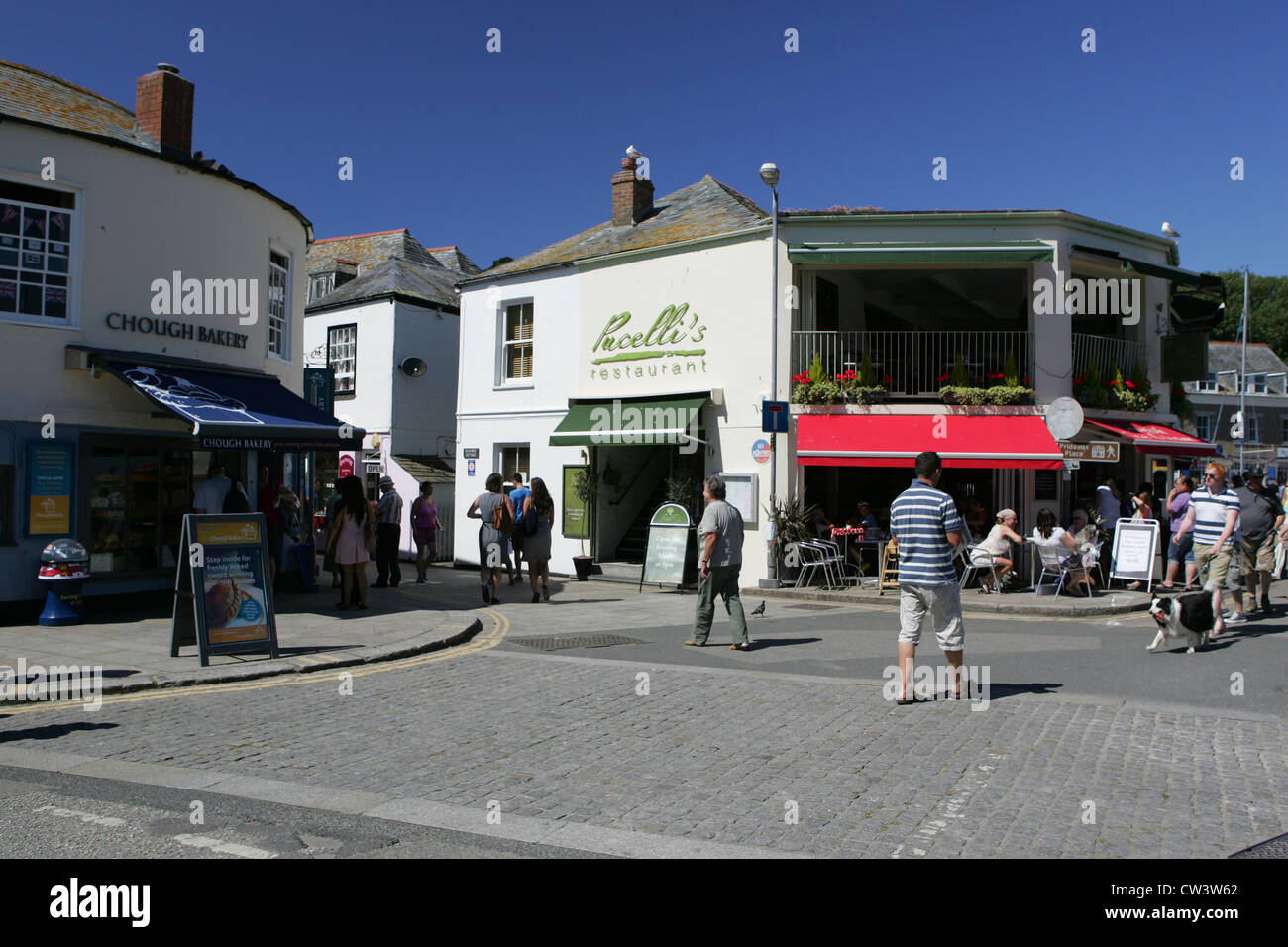 street scene of padstow, cornwall, uk showing chough bakery and pucelli ...