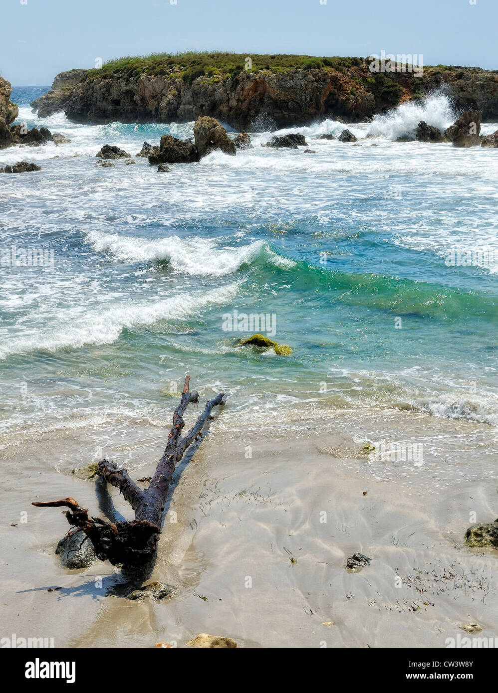 converging waves meeting on santo tomas beach menorca spain Stock Photo ...