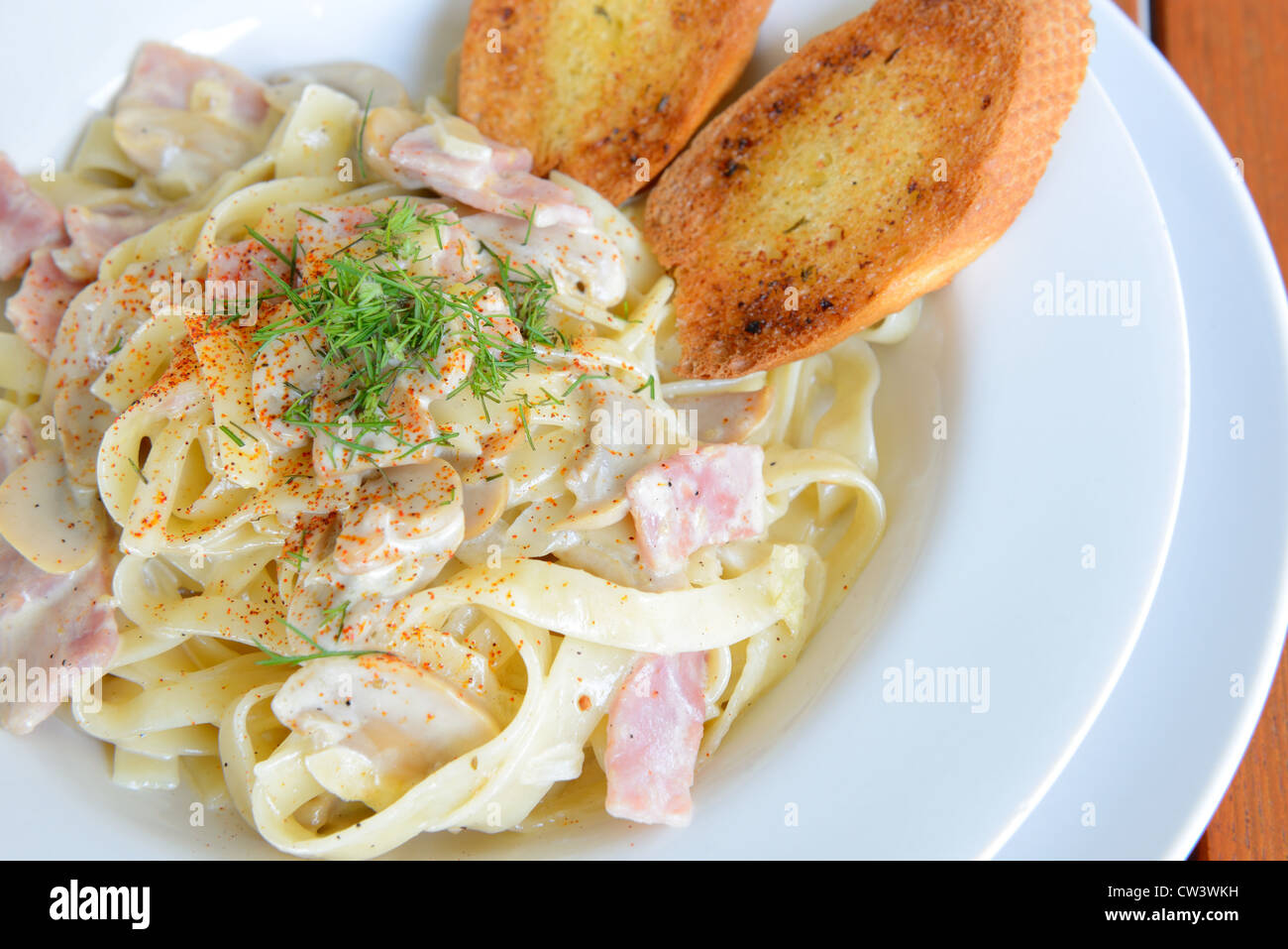 Italian food ,Tagliatelle with Ham and Cheese served on the wooden ...