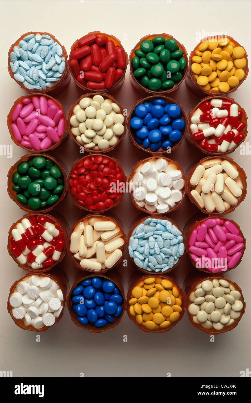 High angle view of an assortment of tablets and capsules in vials Stock ...