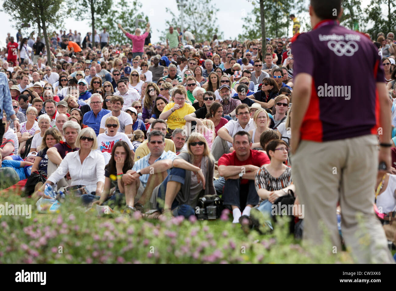 SPECTATORS WATCHING THE BIG TV SCREEN AT THE OLYMPIC GAMES LONDON 2012 ...