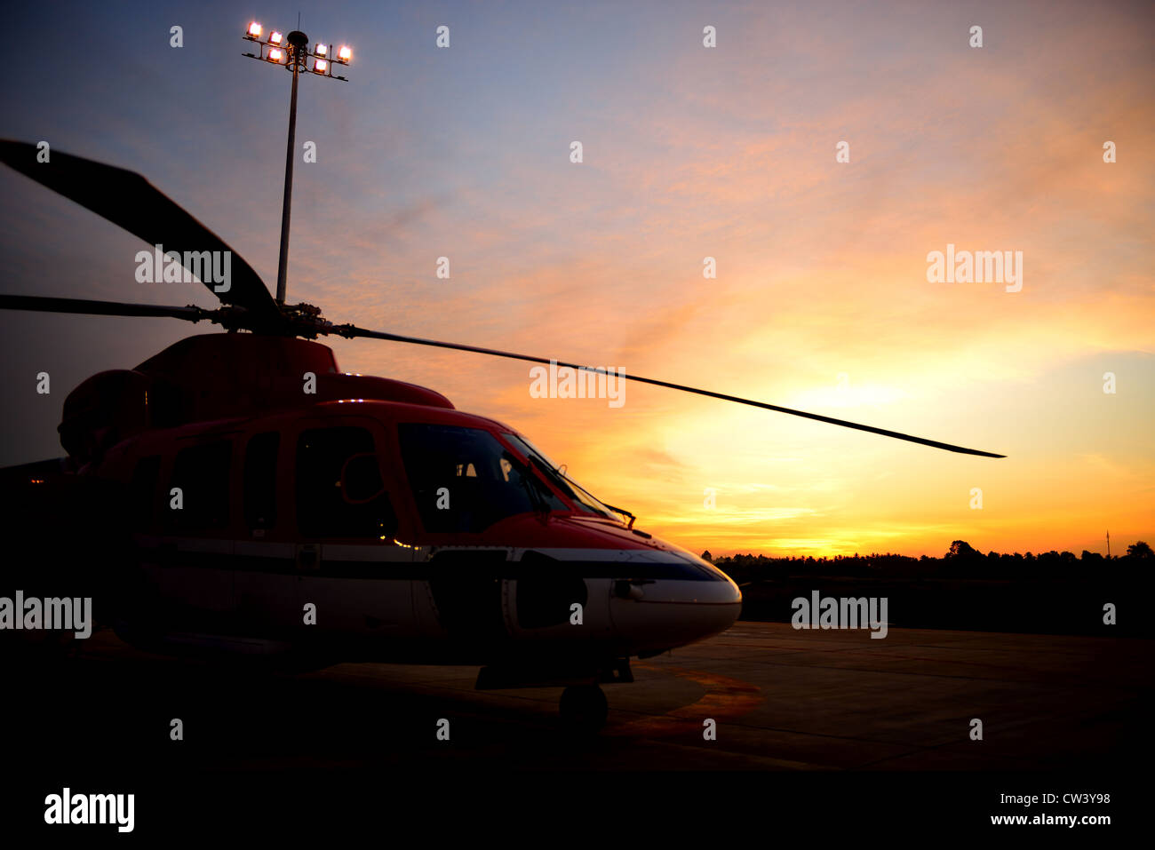silhouette of helicopter on the apron with sunrise background Stock ...