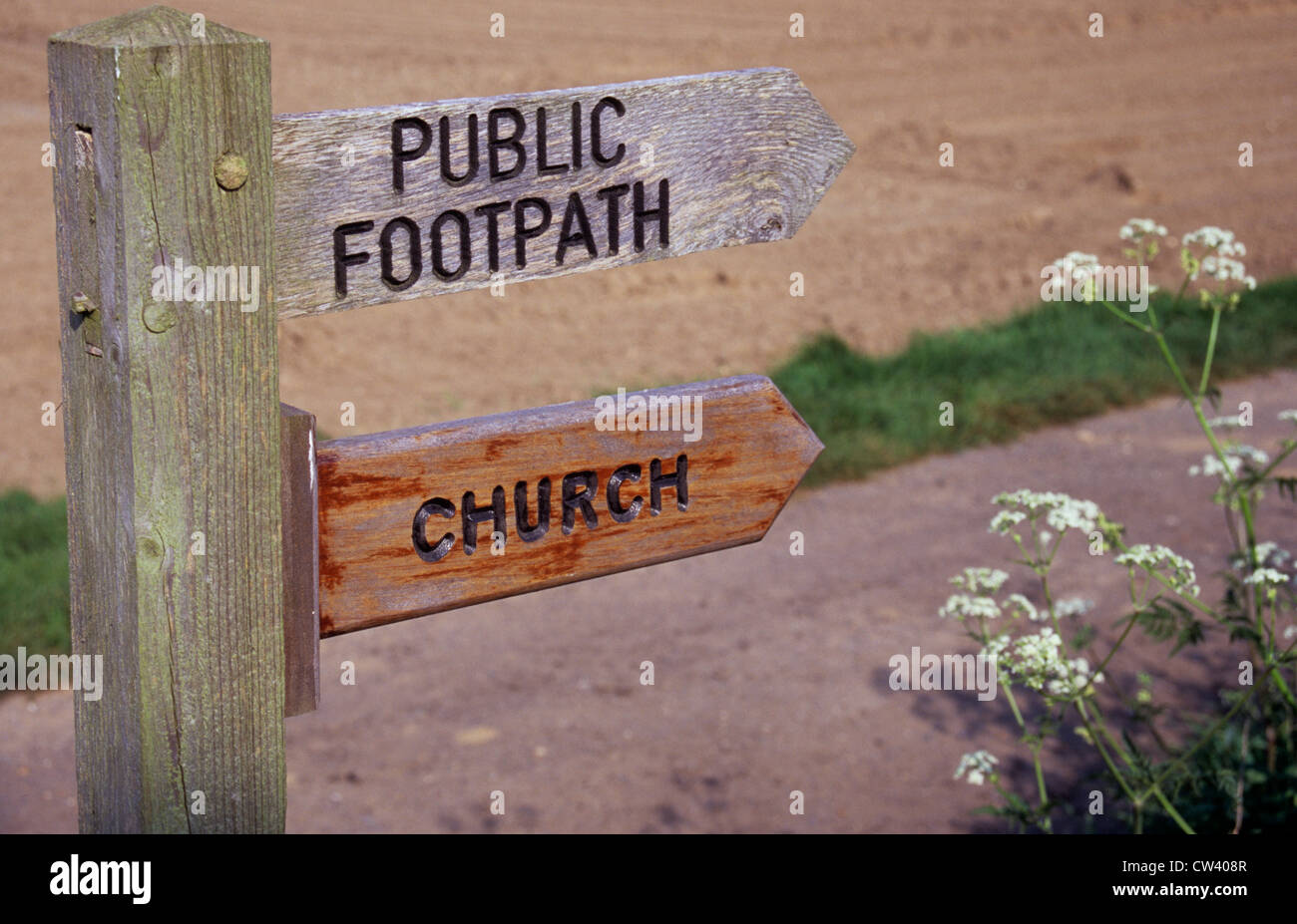 UK England Norfolk Detail wooden signpost with two directional signs ...