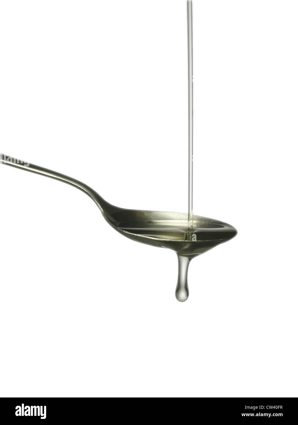 Syrup pouring onto a spoon Stock Photo - Alamy