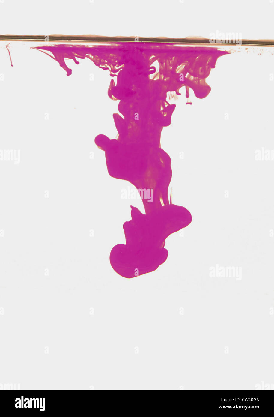 Pink color mixing in water Stock Photo - Alamy