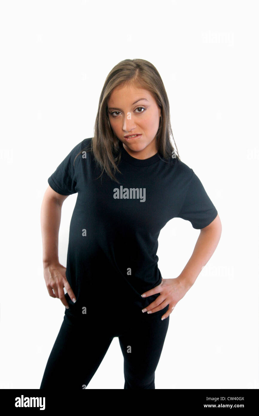 Portrait of a young woman standing with her arms akimbo Stock Photo - Alamy