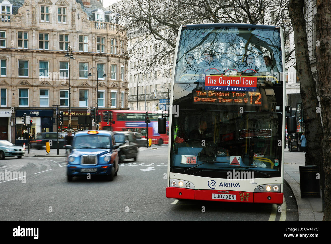 London Sightseeing bus. Tourists love open-top tour bus enable them, a ...
